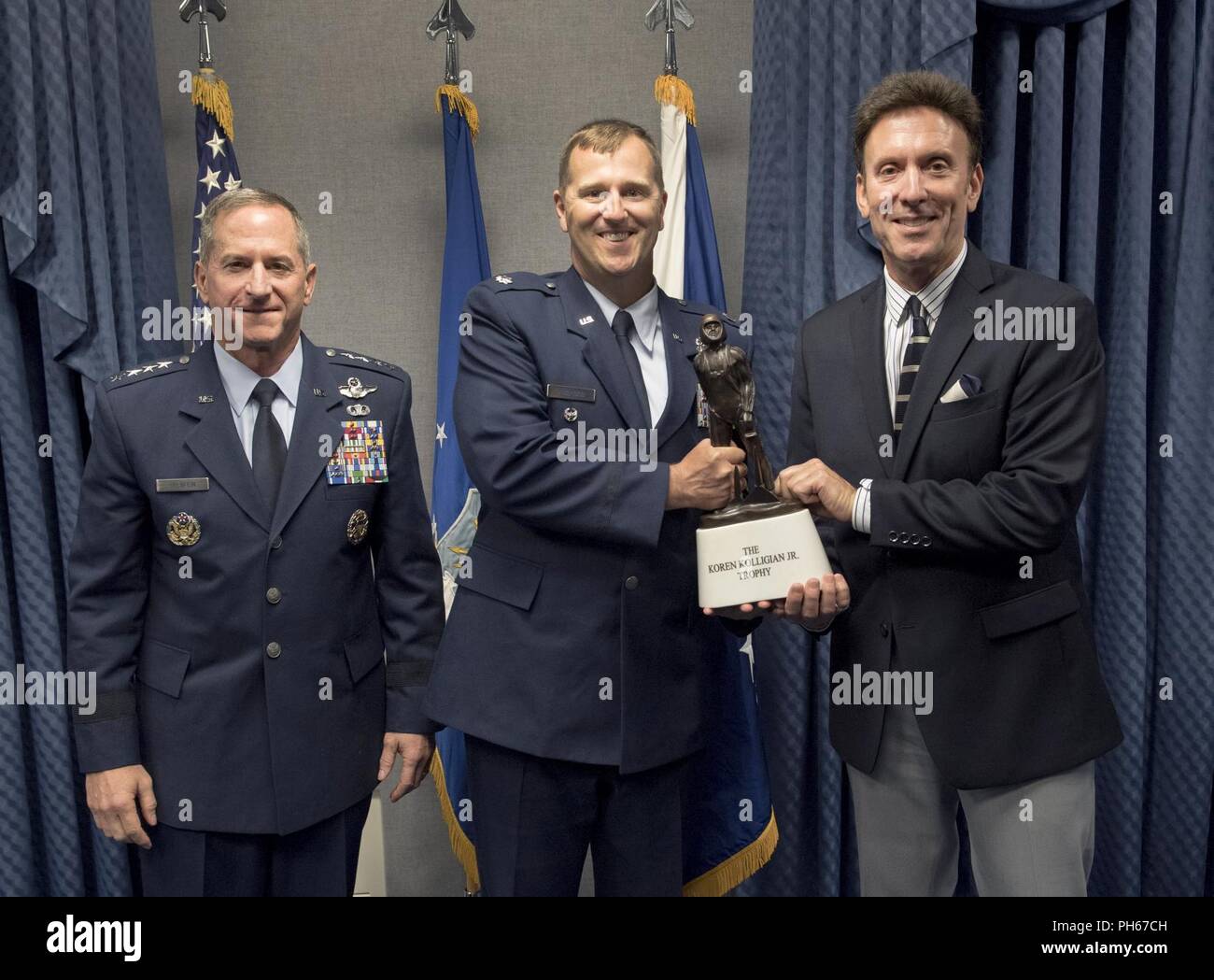 Lt. Col Daniel Finnegan receives the Koren Kolligian Trophy from Mr ...