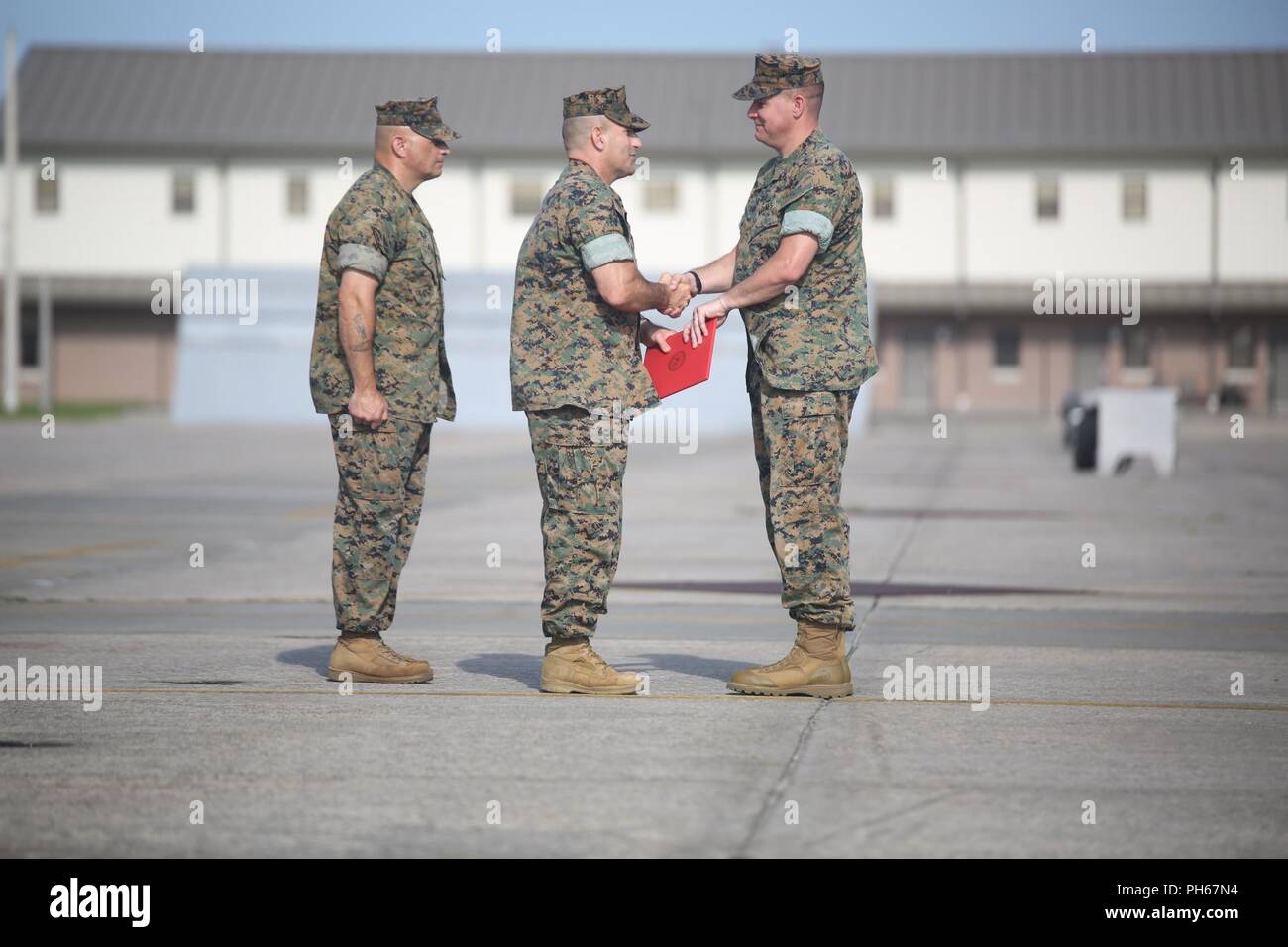 Col. Frank Latt, commanding officer of Marine Aircraft Group 31, awards ...
