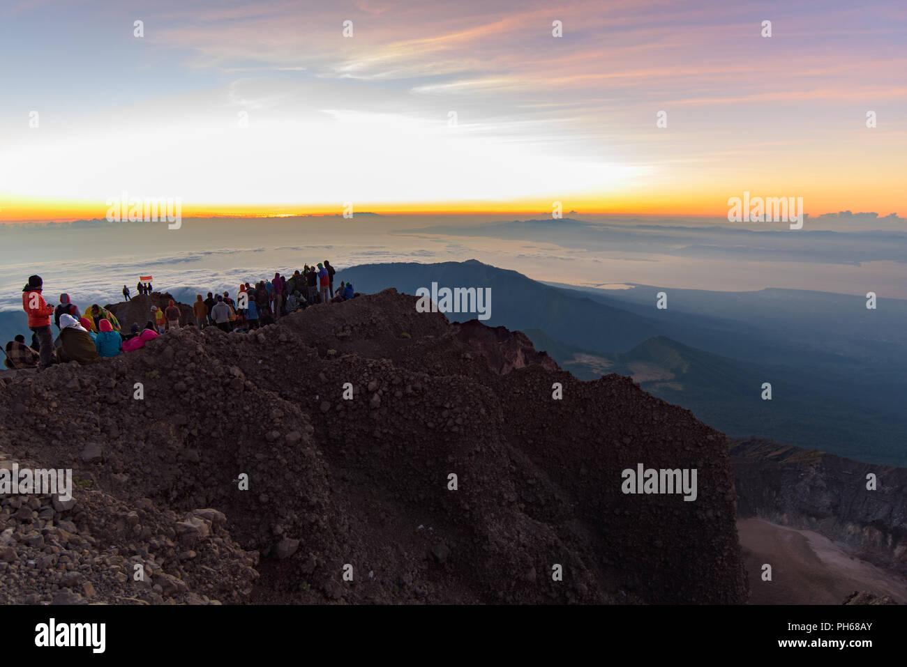 People on the summit of volcano Rinjani watching sunrise, Lombok ...