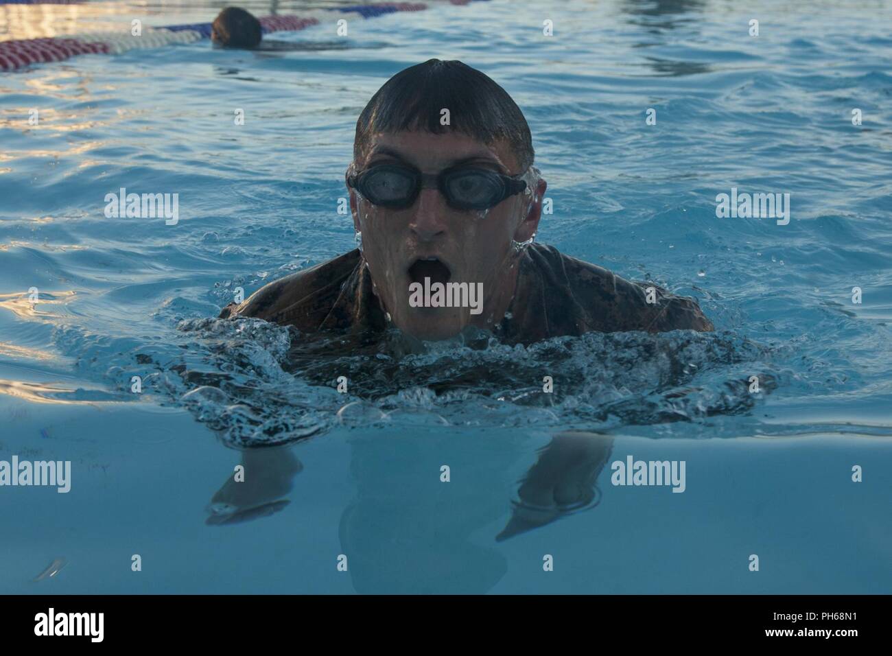 Lance Cpl. Bennette Musielewicz, swims during a reconnaissance screener ...