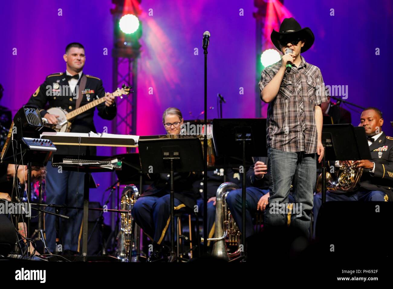 Vocalist Garrett Miles sings with the U.S. Army Materiel Command Band ...