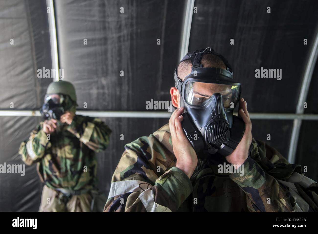 Airman 1st Class Phillip Pham, right, 23d Civil Engineer Squadron ...