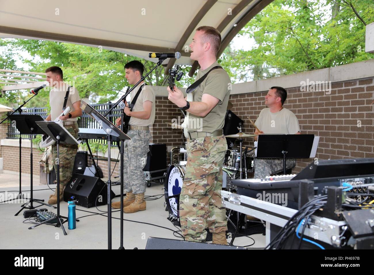 Members of the 451st Army Band of Fort Snelling, Minn., play a song ...