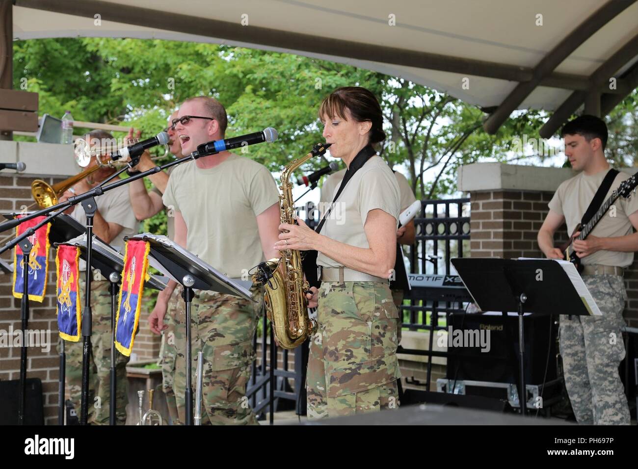 Members of the 451st Army Band of Fort Snelling, Minn., play a song ...
