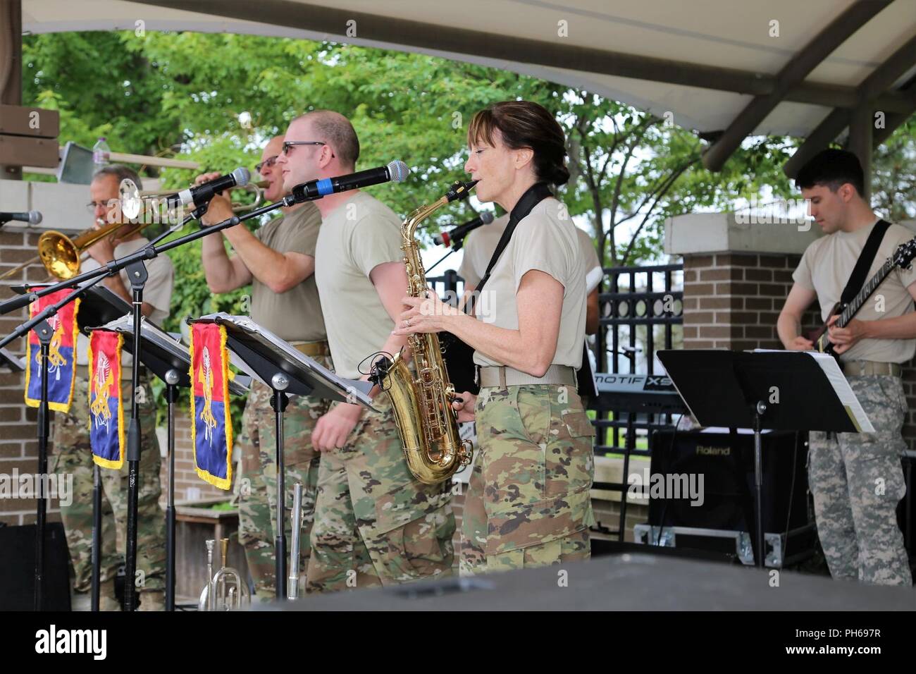 Members of the 451st Army Band of Fort Snelling, Minn., play a song ...