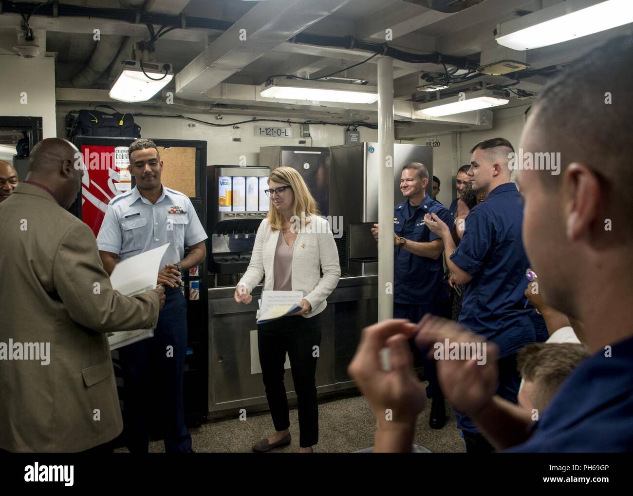 The crew of the Coast Guard Cutter Resolute, a 210-foot medium ...