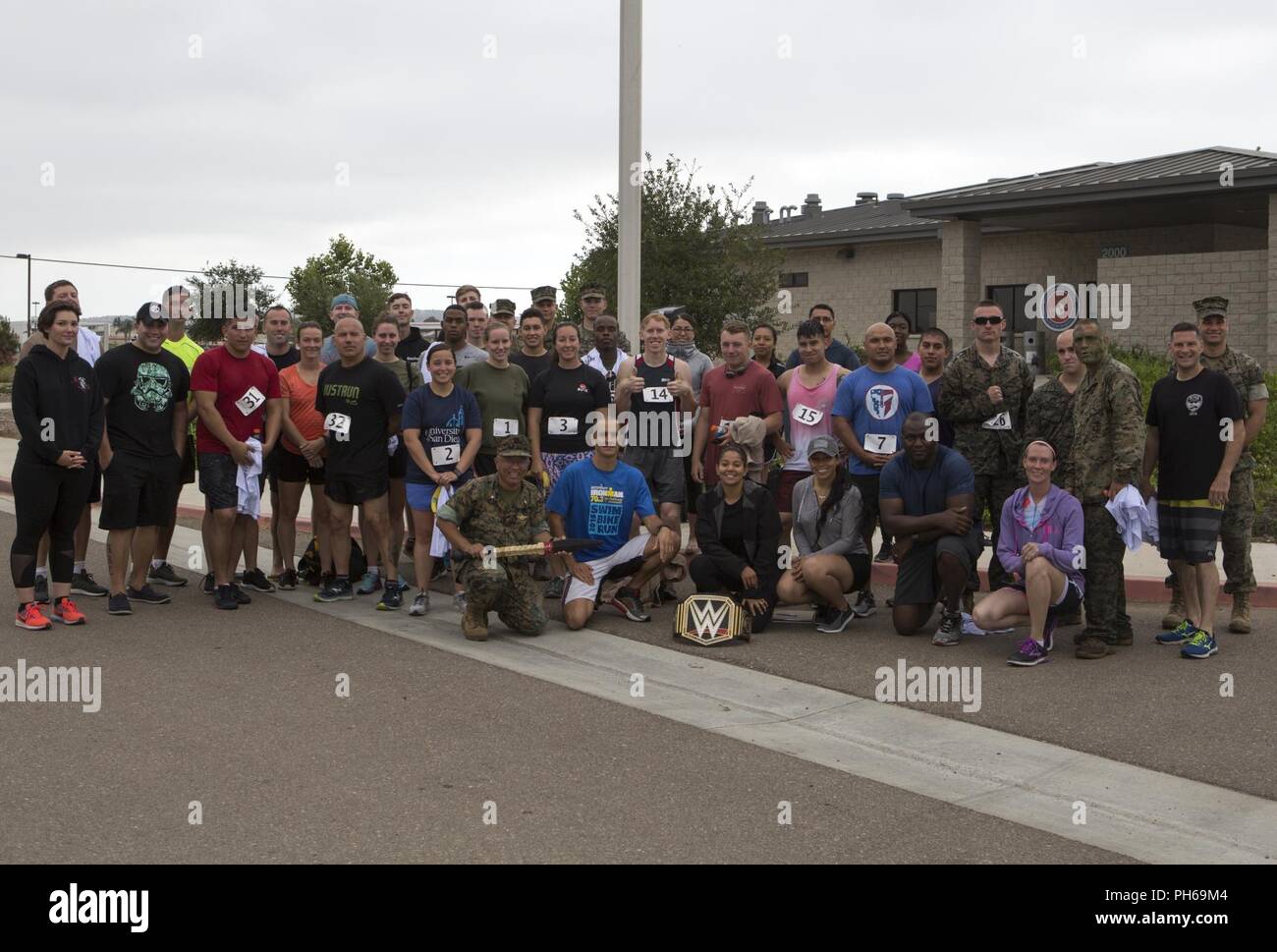 Marines and Sailors pose for a photo following the Aquathon at Marine ...