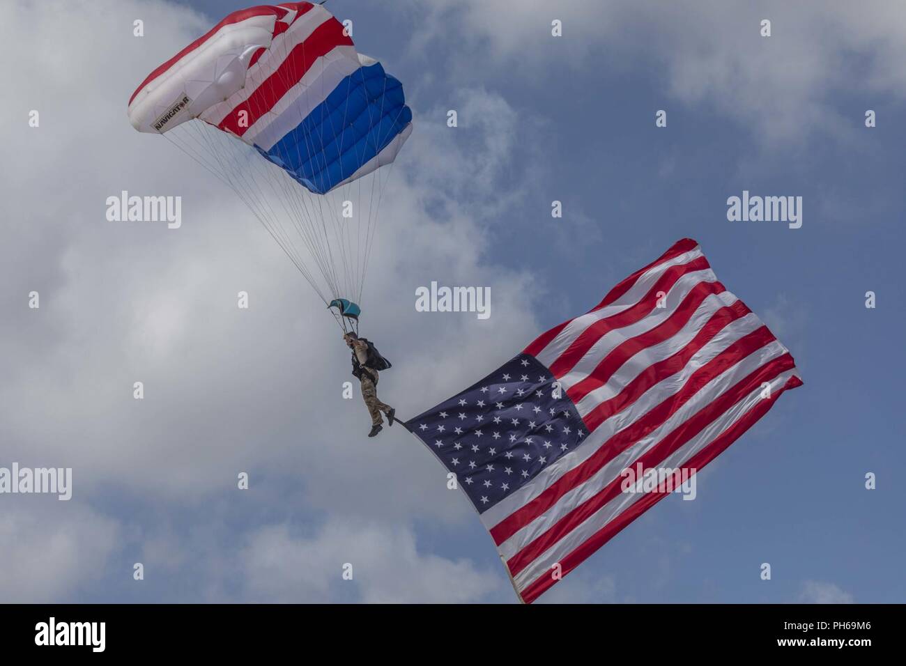U.S. Air Force pararescuemen descend as part of the 330th Recruiting ...