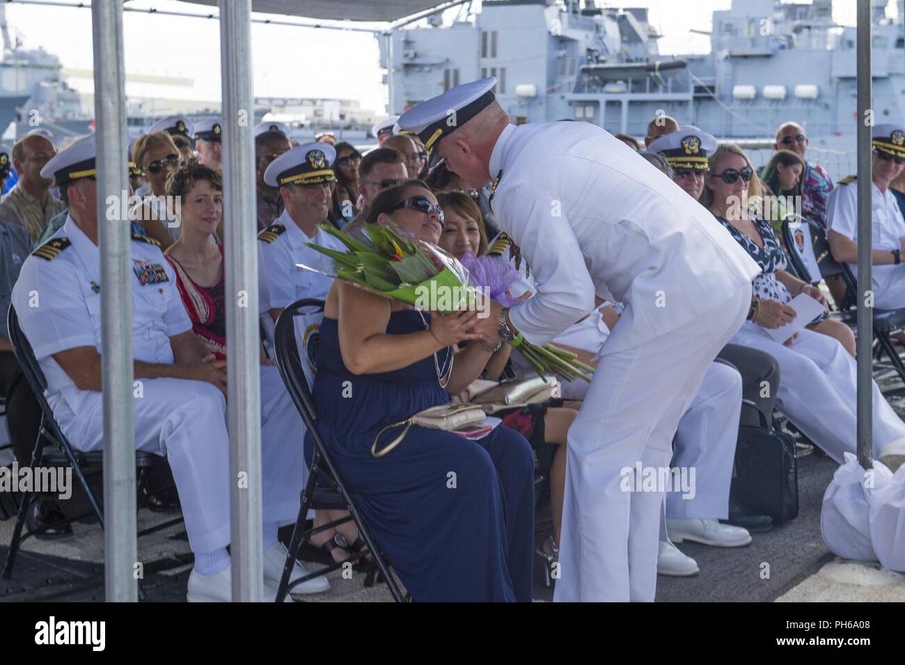 PEARL HARBOR (June 28, 2018) Capt. Joseph Ring presents flowers to his ...