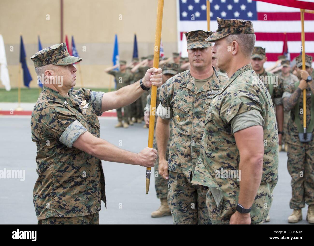 U.S. Navy Capt. Michael O. Enriquez, left, commanding officer, Field ...
