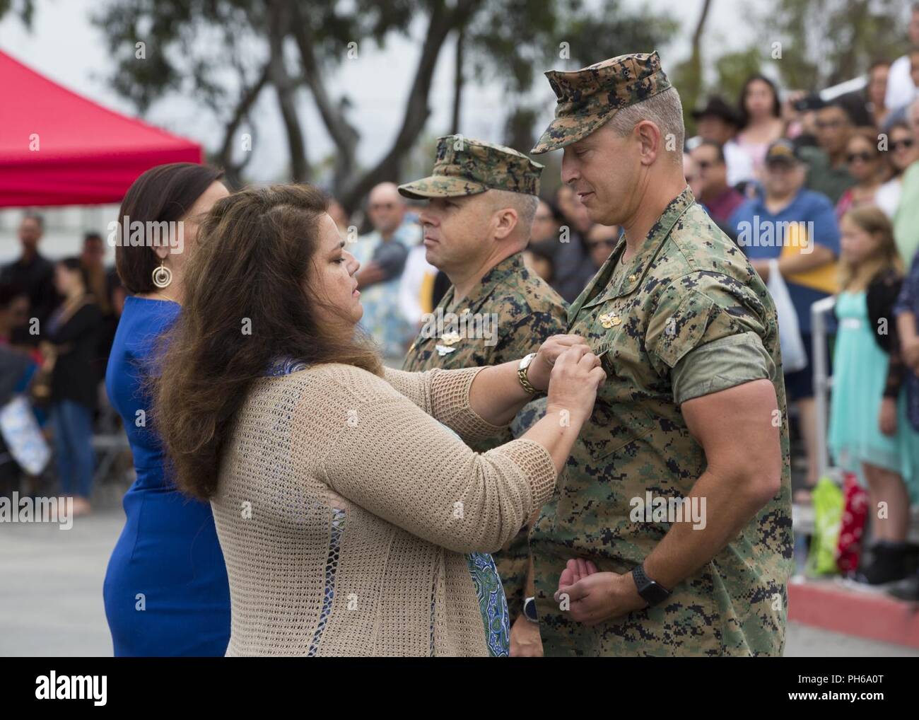 U.S. Navy Capt. Spencer T. Schoen, right, outgoing commanding officer ...