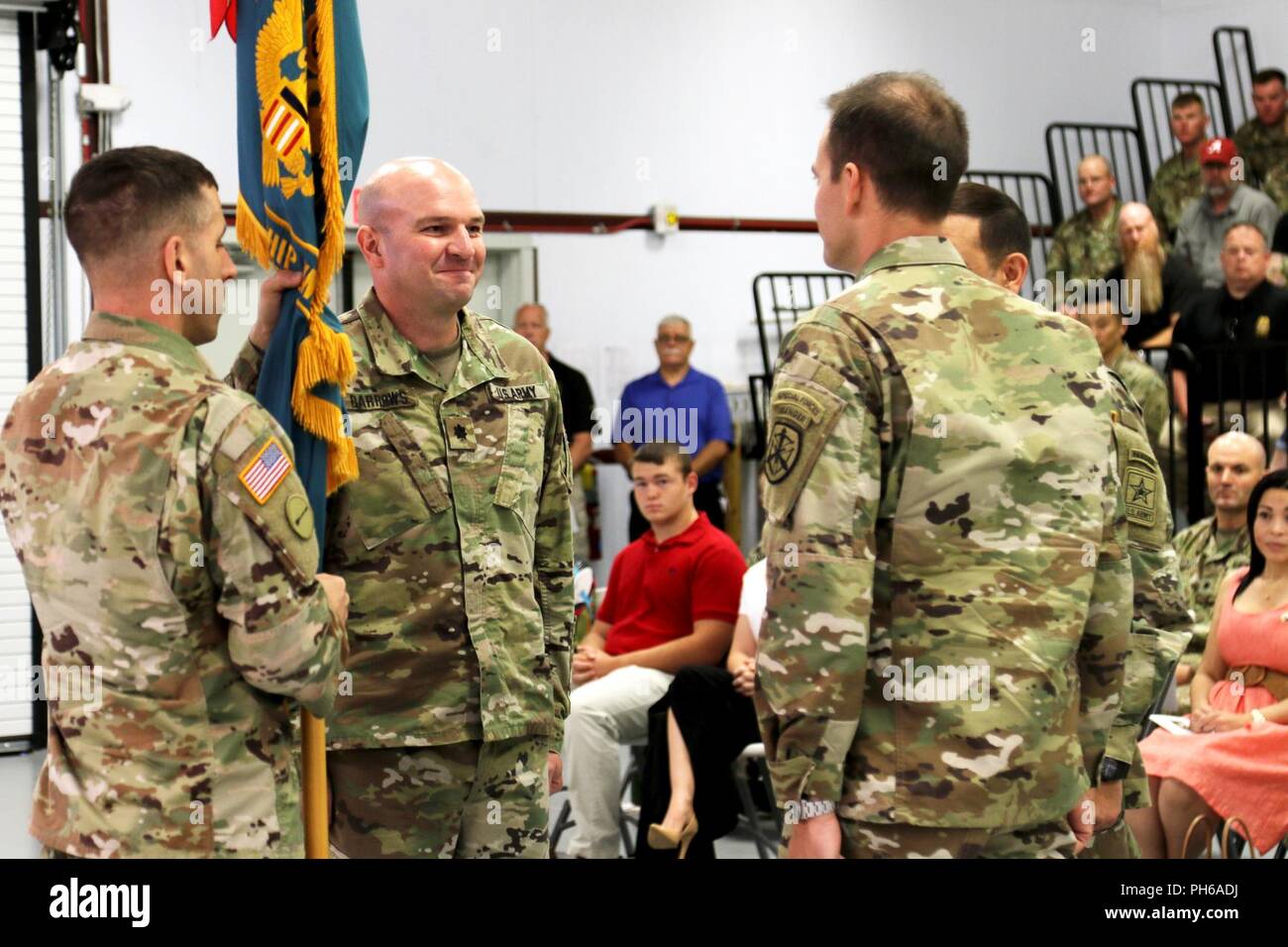 Lt. Col. James Barrows, the outgoing commander, stands ready to receive ...