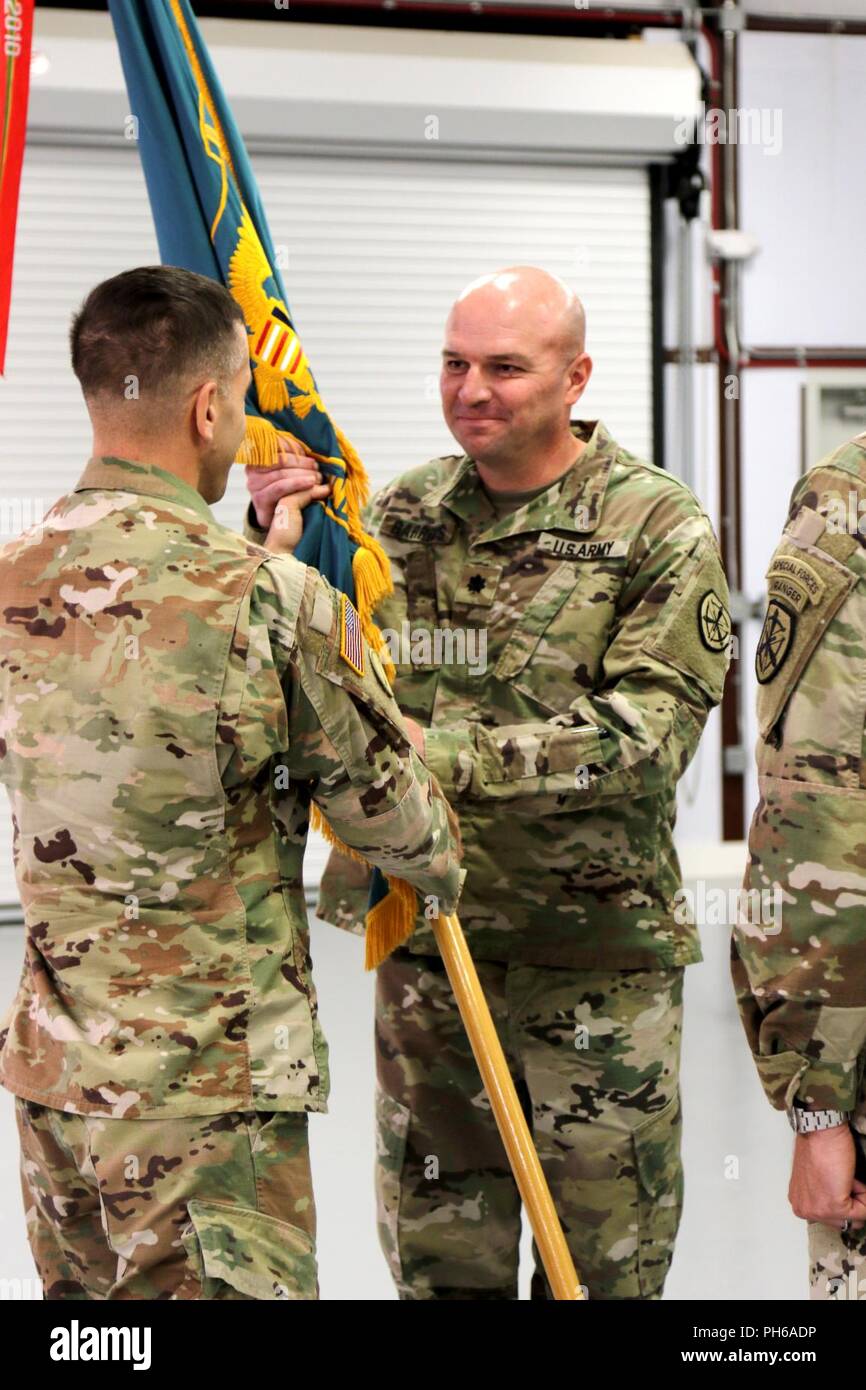 Lt. Col. James Barrows, the outgoing commander, accepts the battalion ...