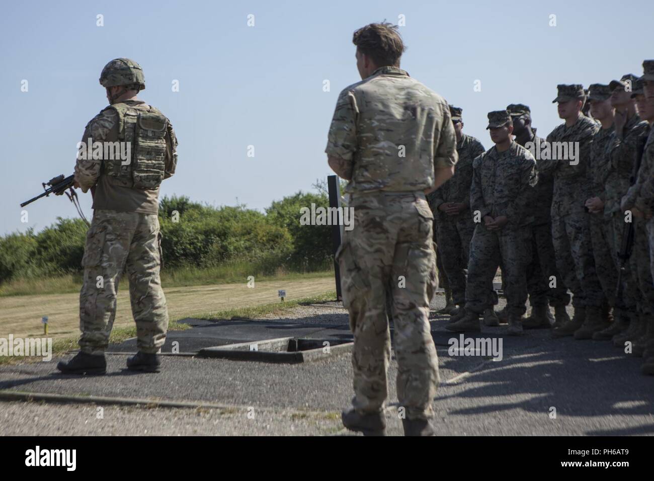 British Army Commando Sgt. Kees Willis, center, communication sergeant ...