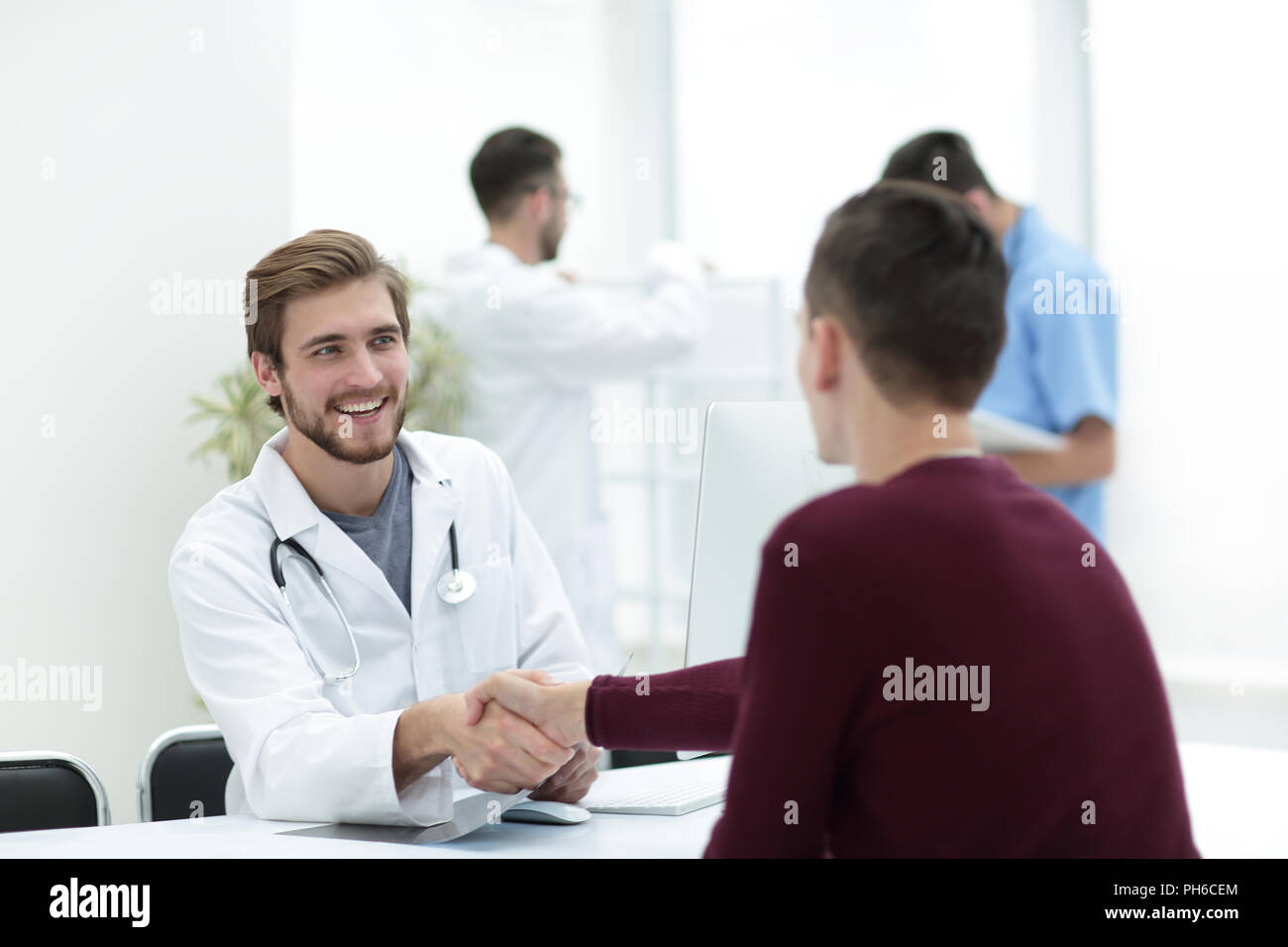 Successful treatment doctor handshake hi-res stock photography and ...