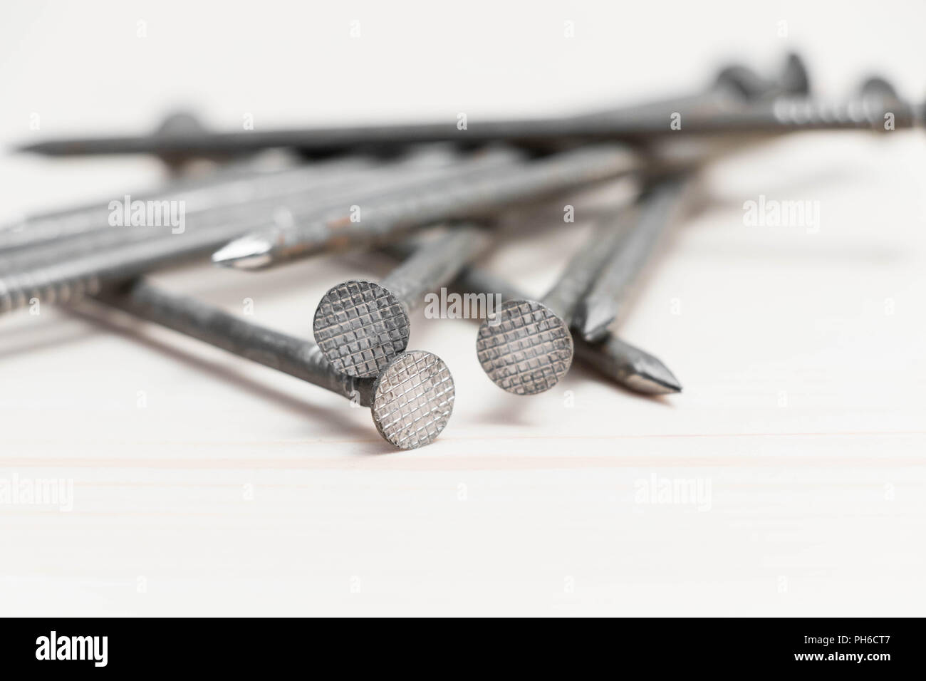 Big nail spike carpenter rusty head pike Stock Photo - Alamy