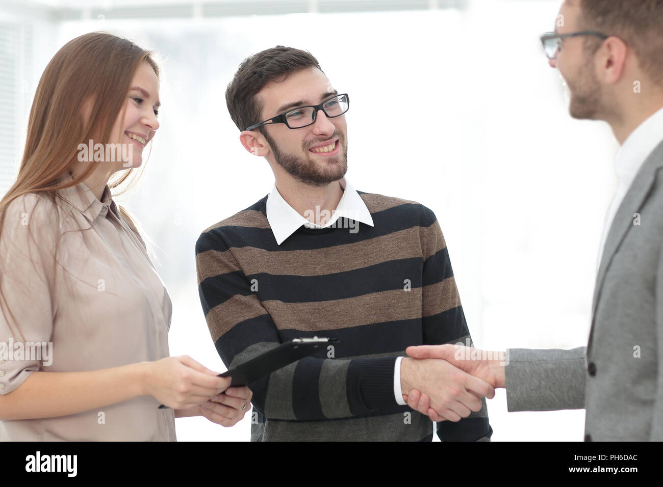 handshake Manager and employee in the office Stock Photo - Alamy
