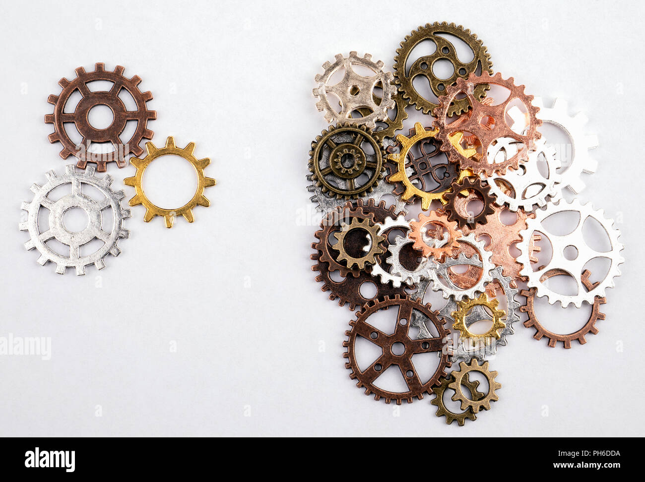 Different sizes and colored gears on a white background Stock Photo - Alamy