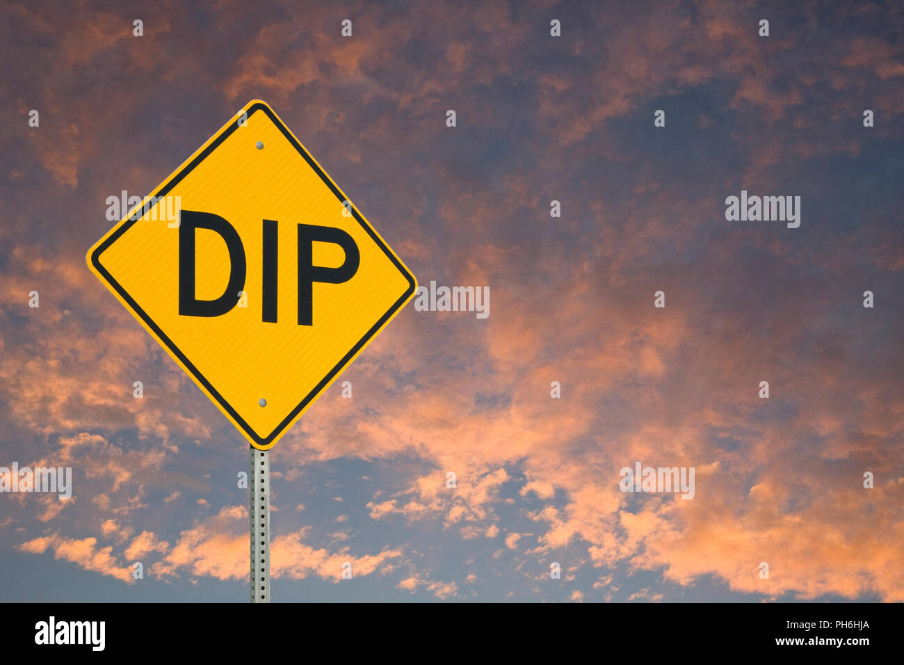 Dip Sign With Sunset, Orange Clouds Stock Photo - Alamy