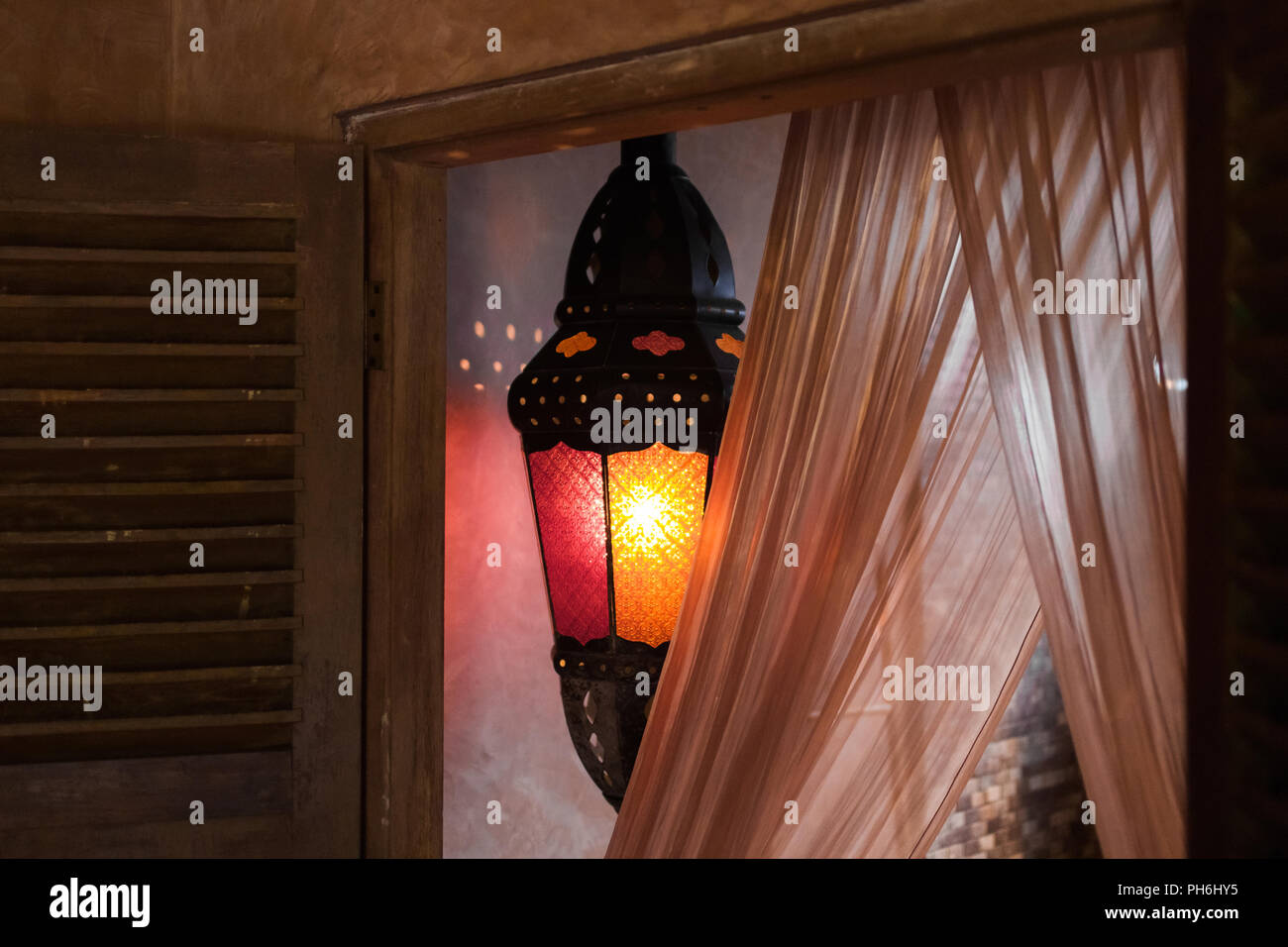 Vintage metal lamp inside room with warm light Stock Photo - Alamy