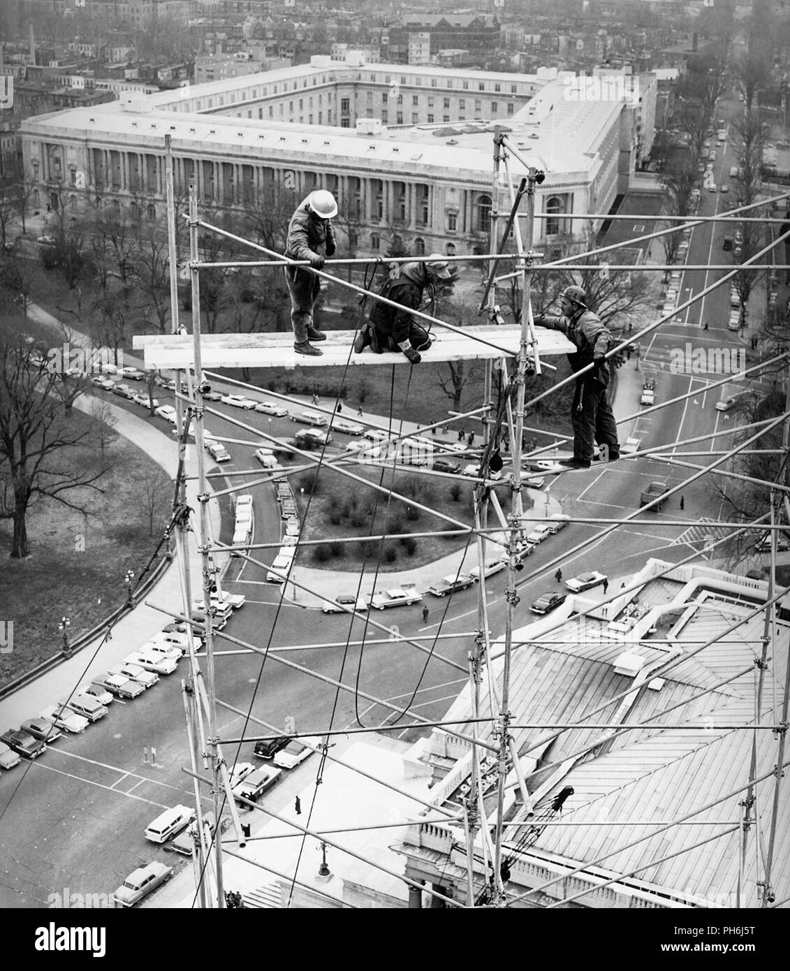 Workmen removing scaffolding tower on the southeast side of the Dome ...