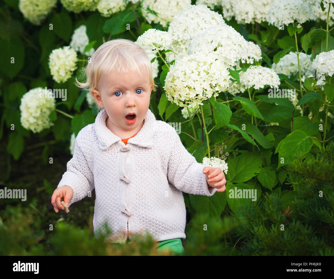 Cute adorable surprised crying screaming baby boy girl child standing ...