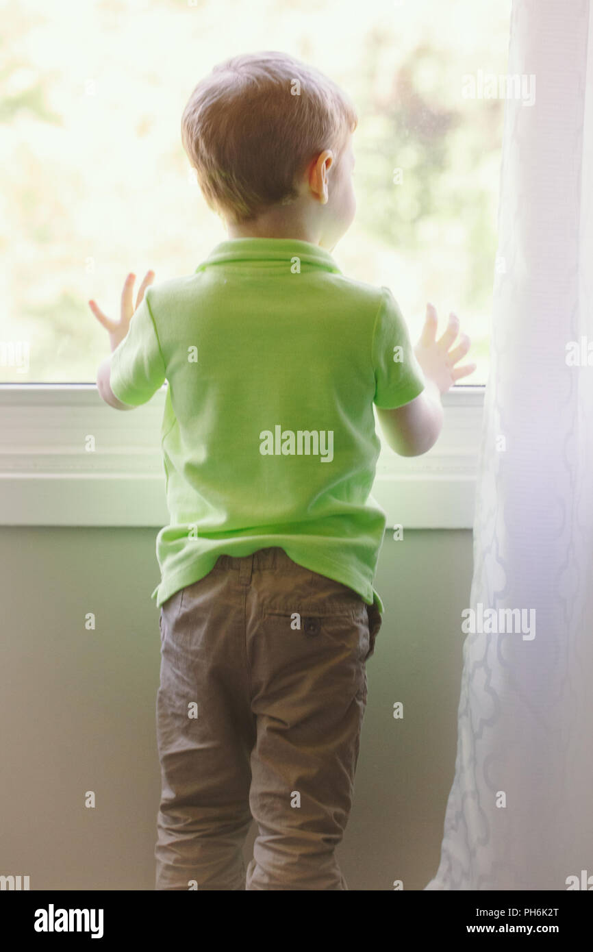 Boy Waiting For Someone