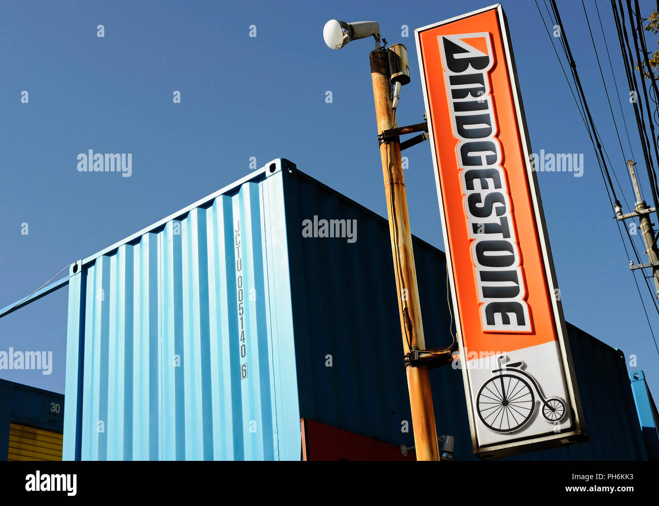 A Bridgestone Corp. sign is shown outside a dealer in Tokyo, Japan on ...
