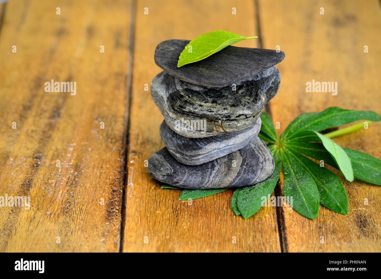 Wellness stones Balance Flower Stock Photo - Alamy