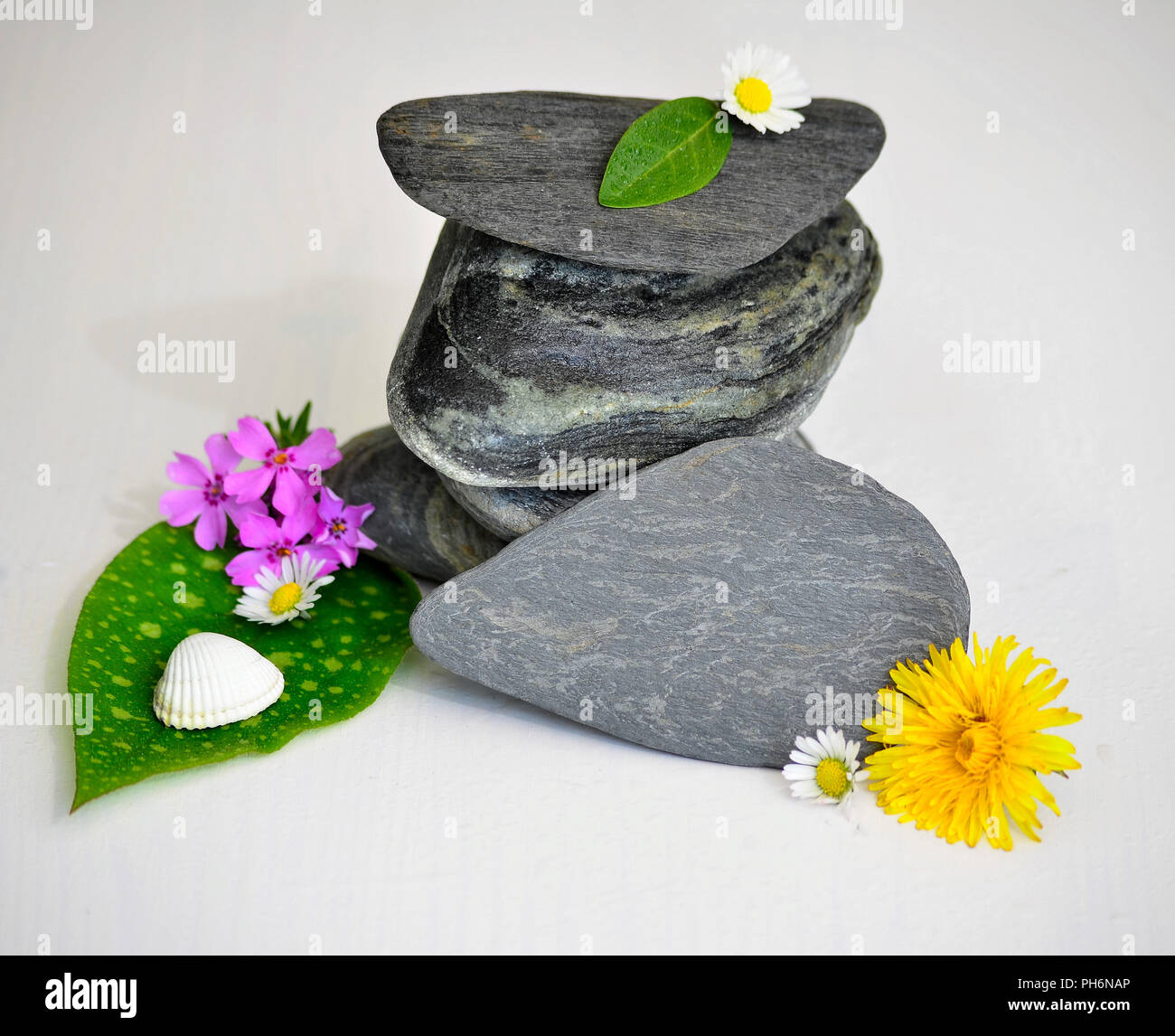 Wellness stones Balance Flower Stock Photo - Alamy