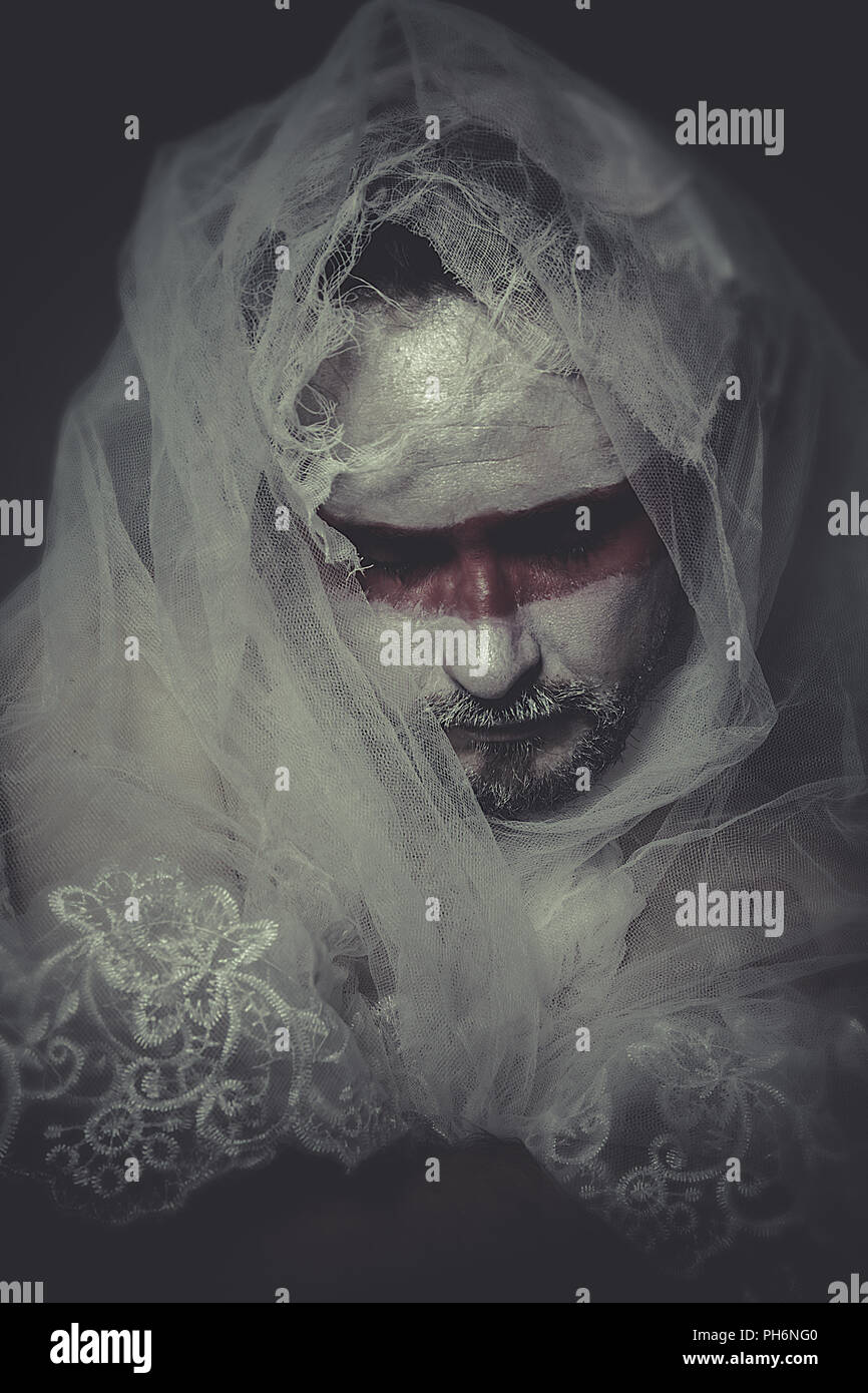 man with lace veil and bandages, wound concept, pain and suffering ...