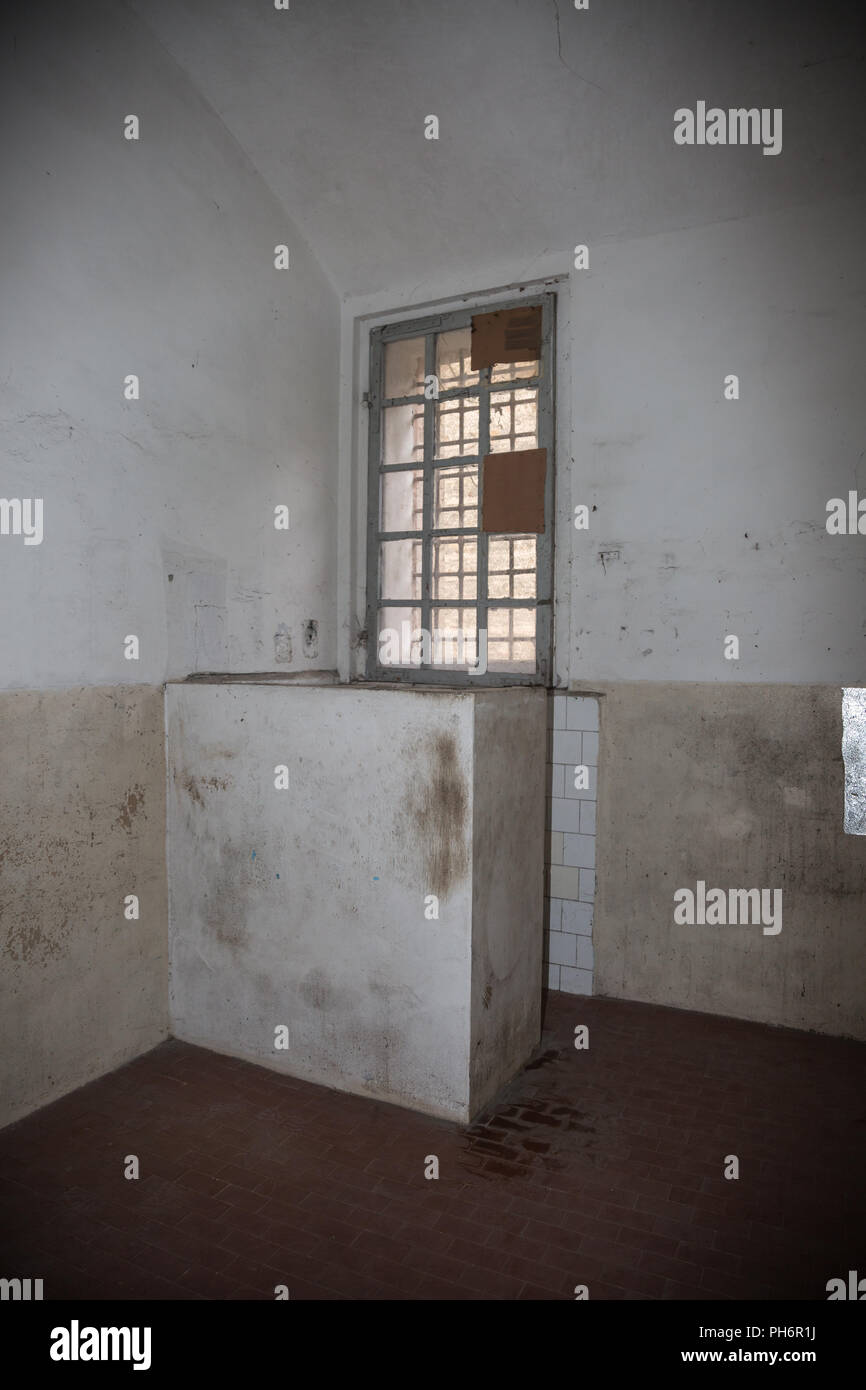 Empty Room with a Toilet in an Old Prison Stock Photo - Alamy