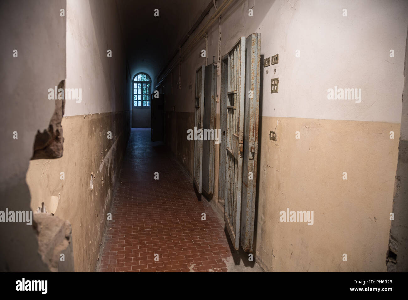 Long Corridor and White and Worn Walls of a Prison Stock Photo - Alamy