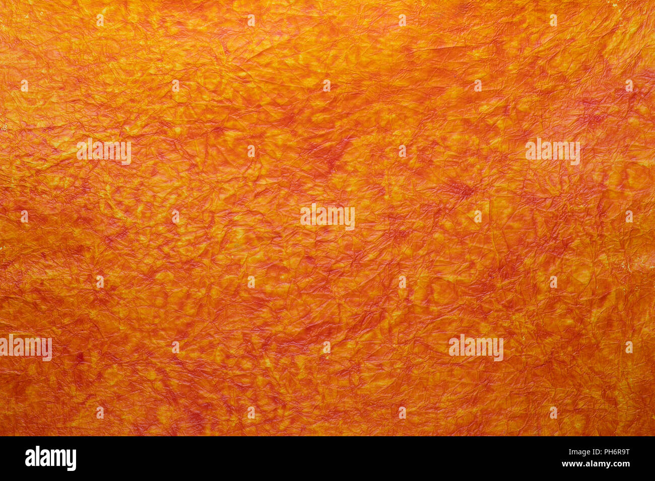 Handmade paper texture with parchment fibers. In orange, yellow ...