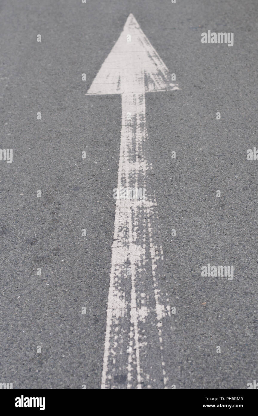 Road with white arrow Stock Photo - Alamy