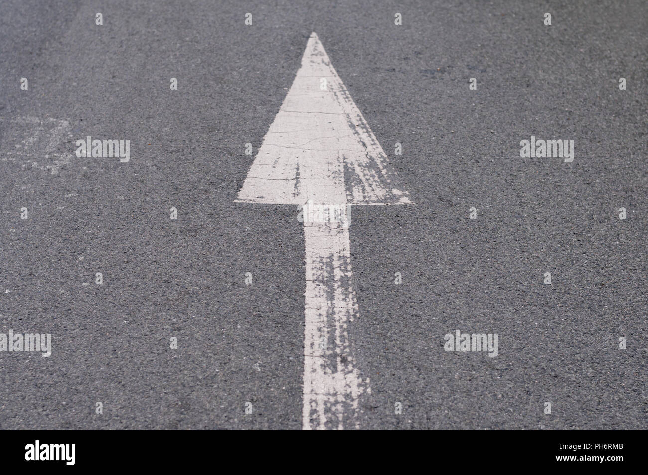 Road with white arrow Stock Photo - Alamy