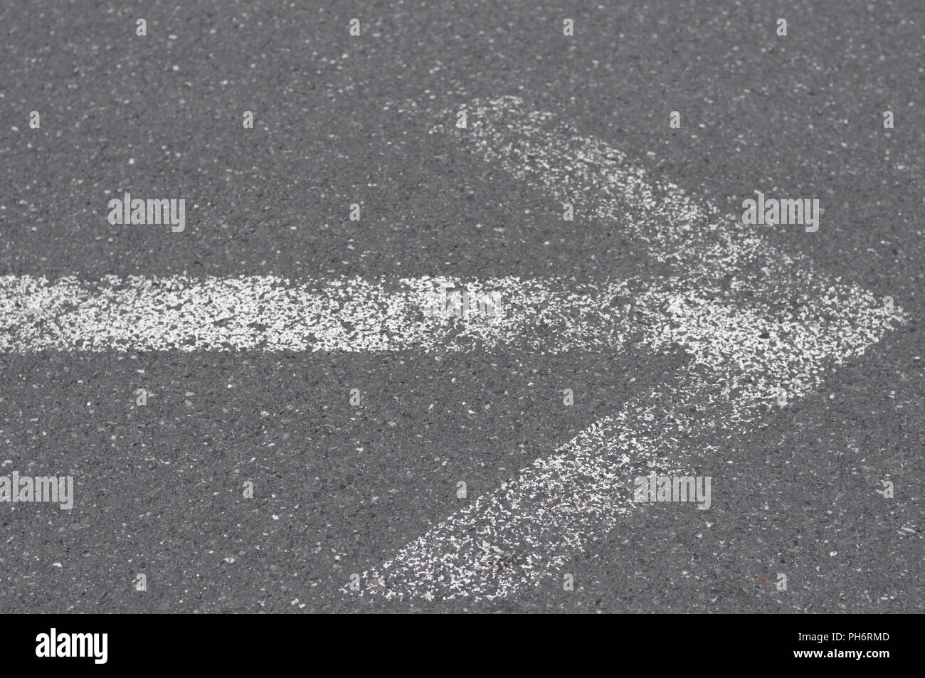 Road with white arrow Stock Photo - Alamy