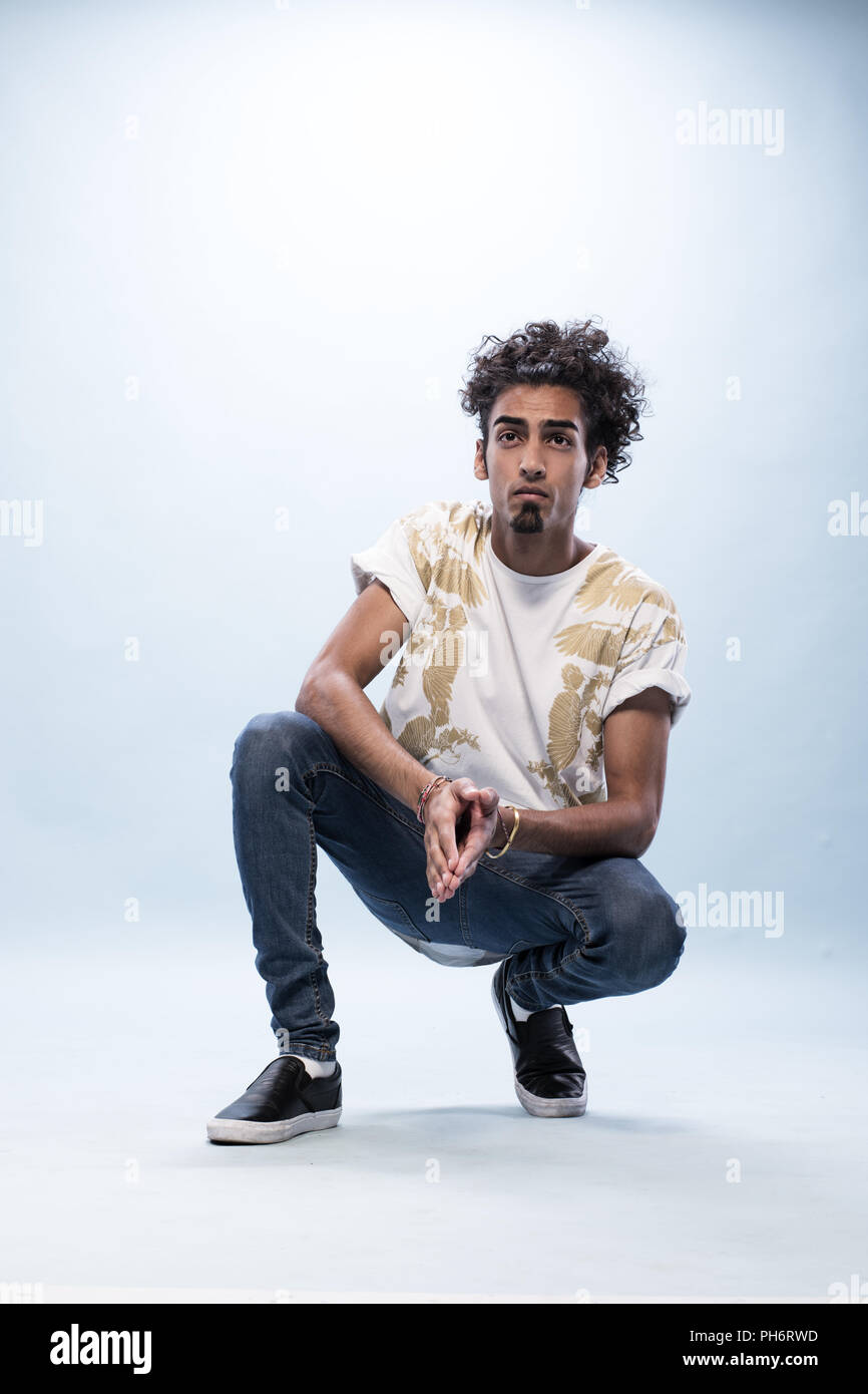 Squatting jeans hi-res stock photography and images - Alamy