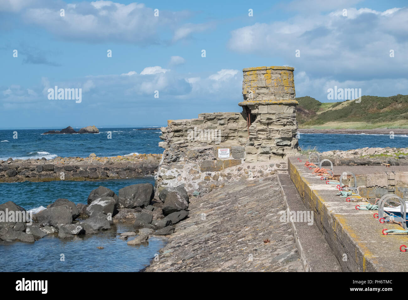 The ancient and crumbling sea defences at Dunure ancient Port and ...