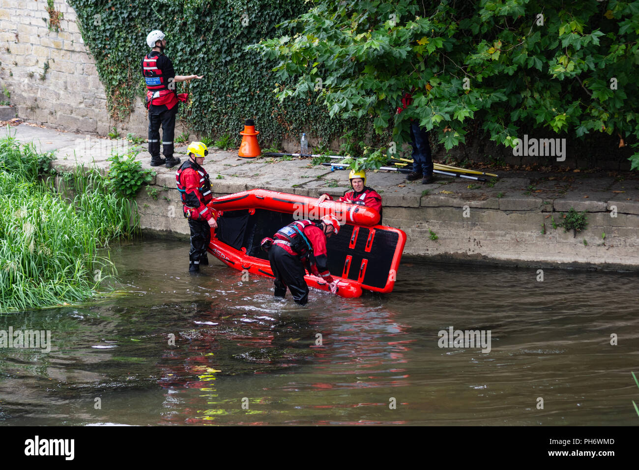 Members of Wiltshire search & rescue team take their boat from the ...
