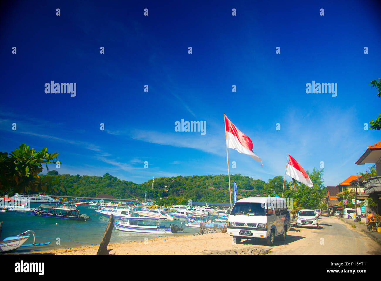 Indonesian Flag nearby the ocean in Bali, Indonesia. Bali is an ...