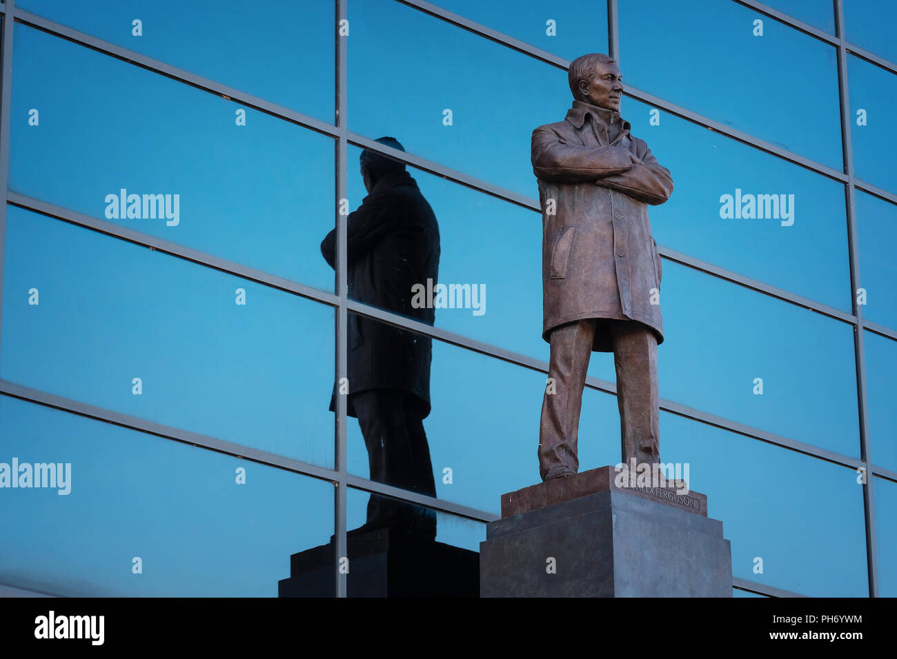 MANCHESTER, UK - MAY 19 2018: Sir Alex Ferguson Bronze statue in front ...