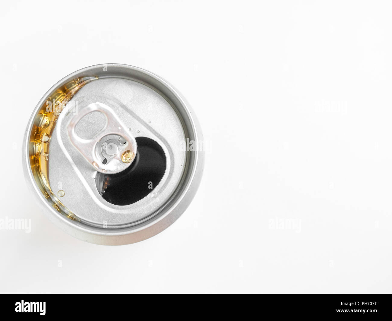 Opened can with sparkling water isolated on white background with space ...