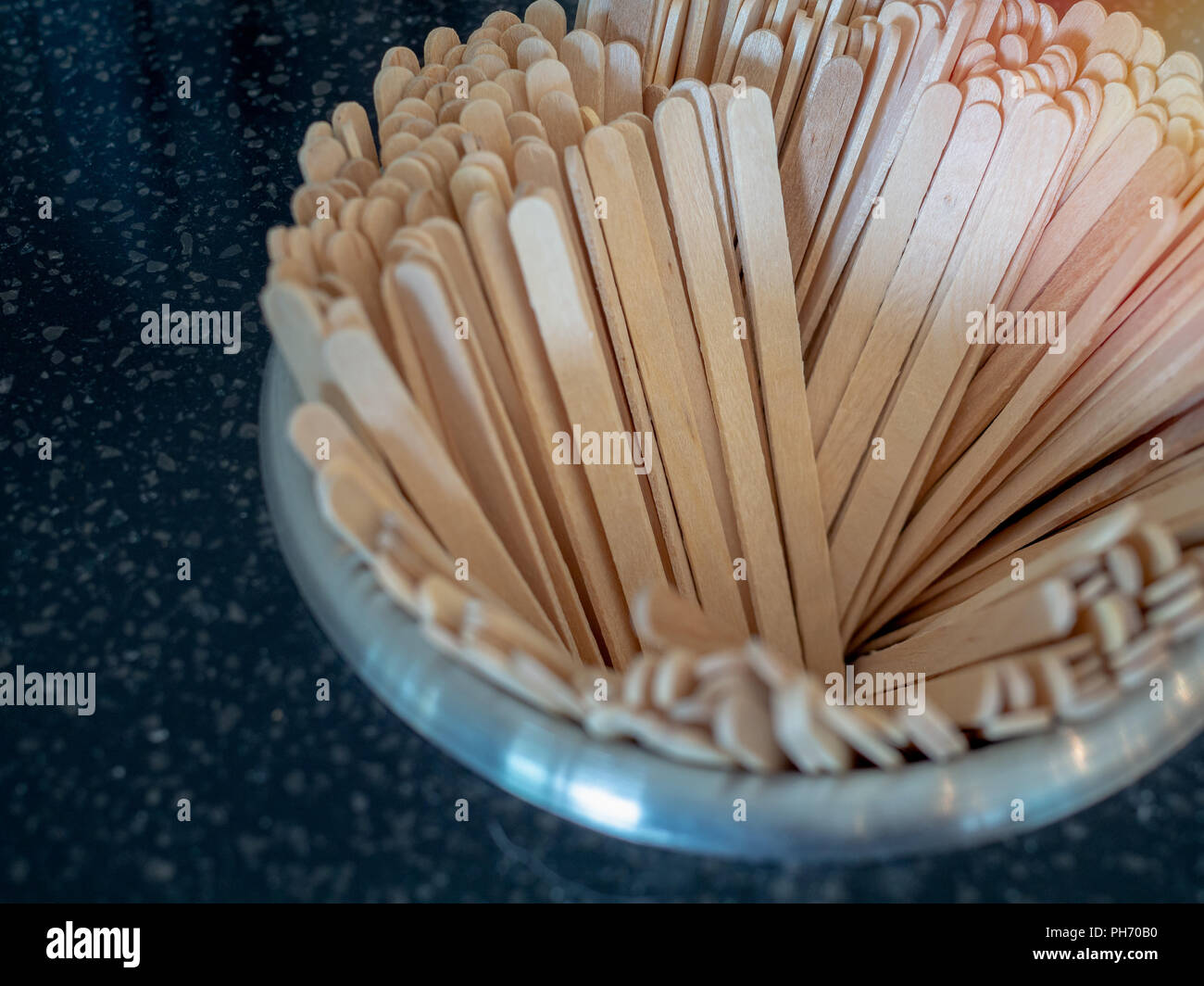Wooden stir sticks in stainless pit on coffee bar in cafe Stock Photo ...