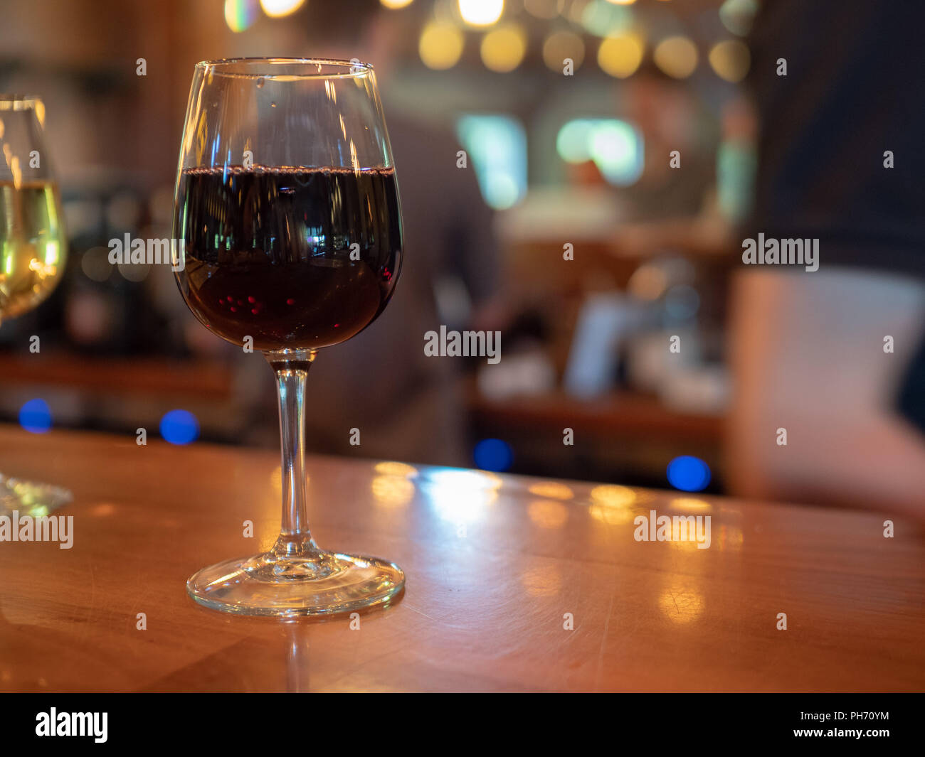 Glass of red wine sitting on counter in a winery bar counter top Stock ...