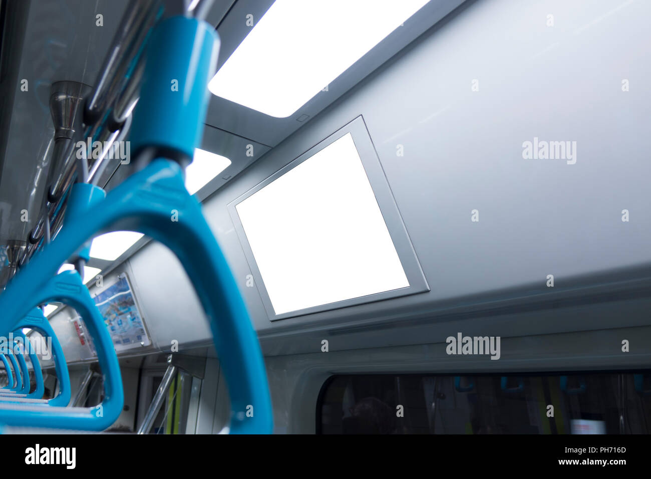 A blank lighted signboard inside a high speed train, with space for ...
