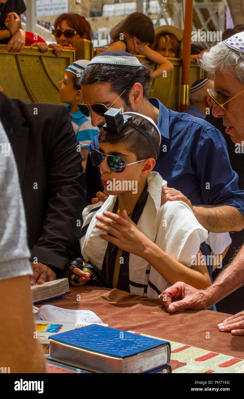 10 May 2018 A Jewish family and friends celebrate a young man's bar ...
