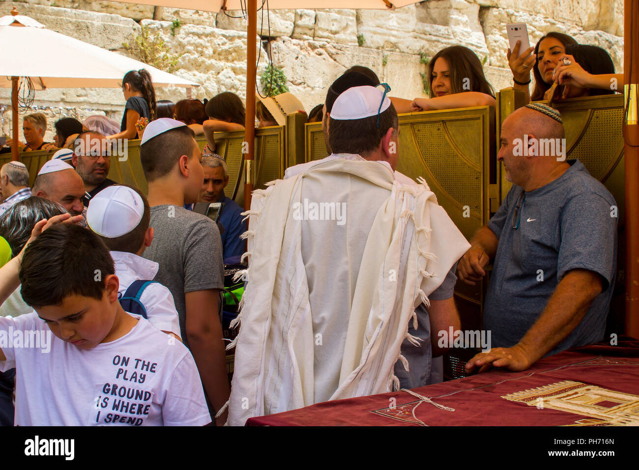 10 May 2018 A Jewish family and friends celebrate a young man's bar ...