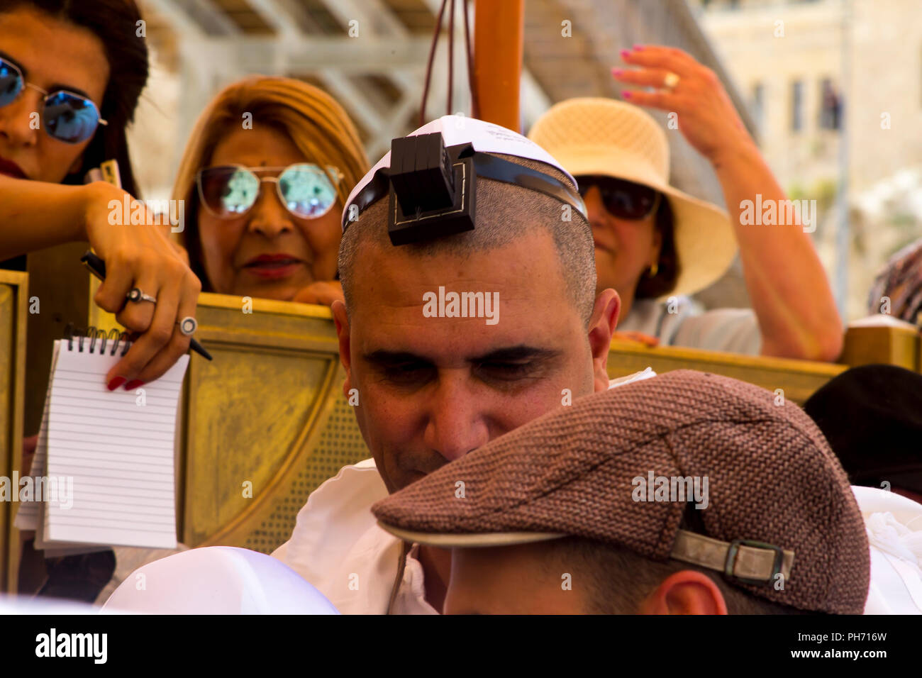 10 May 2018 A Jewish family and friends celebrate a young man's bar ...