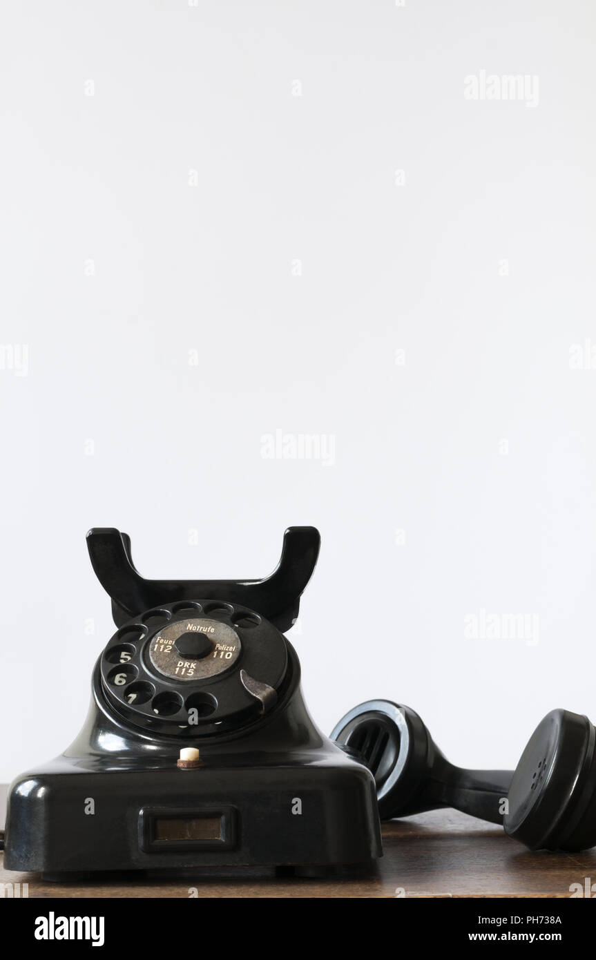 Old phone with white background for copy space Stock Photo - Alamy